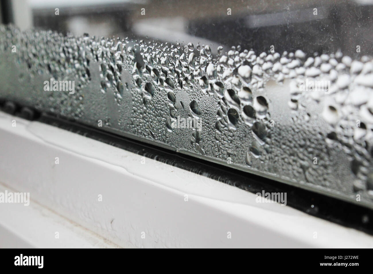 Water pooling from window condensation Stock Photo - Alamy