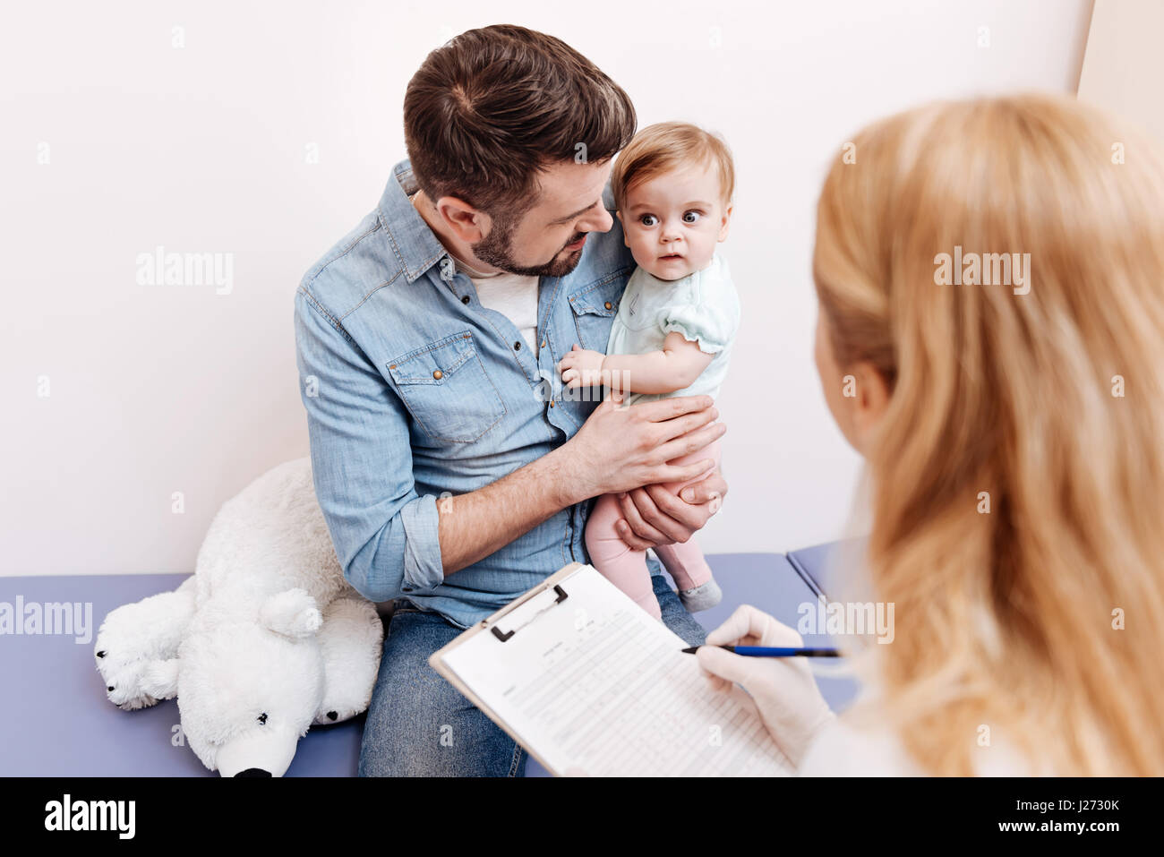 Enigmatical baby making funny faces Stock Photo - Alamy