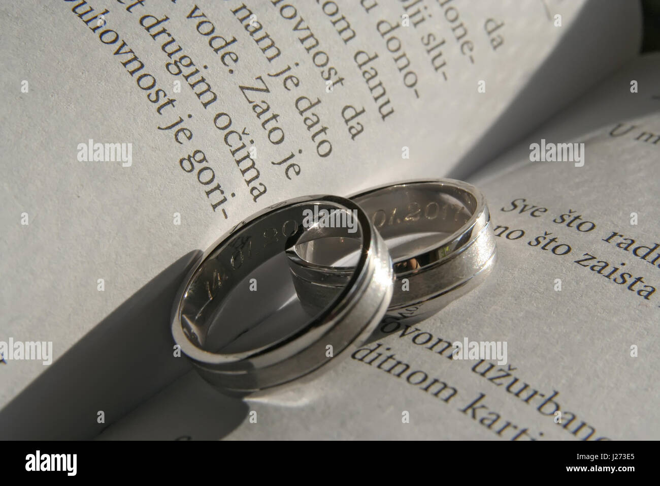 White gold ring. Wedding rings in a book Stock Photo - Alamy