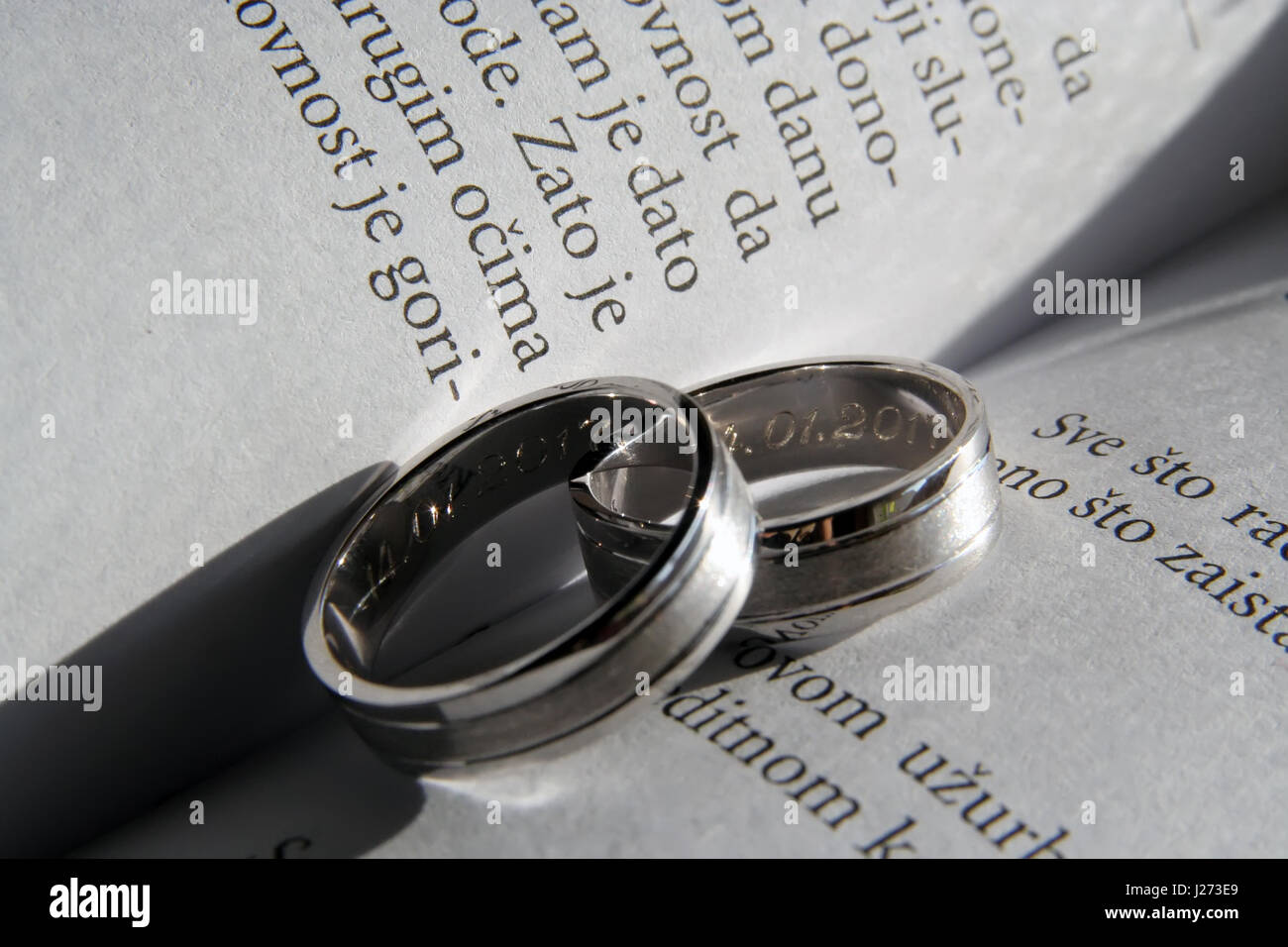 White gold ring. Wedding rings in a book Stock Photo - Alamy