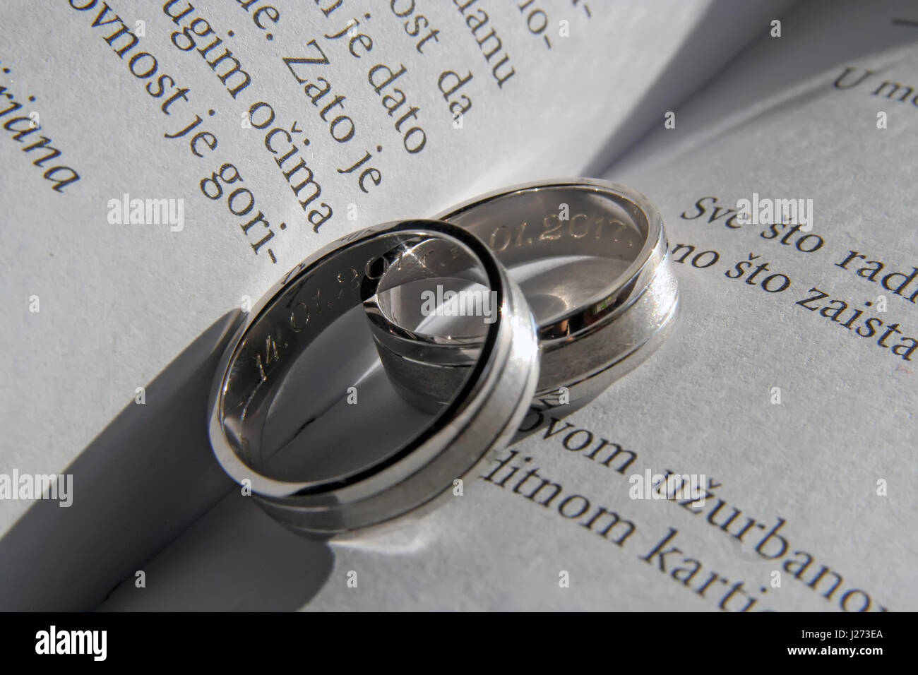 White gold ring. Wedding rings in a book Stock Photo - Alamy