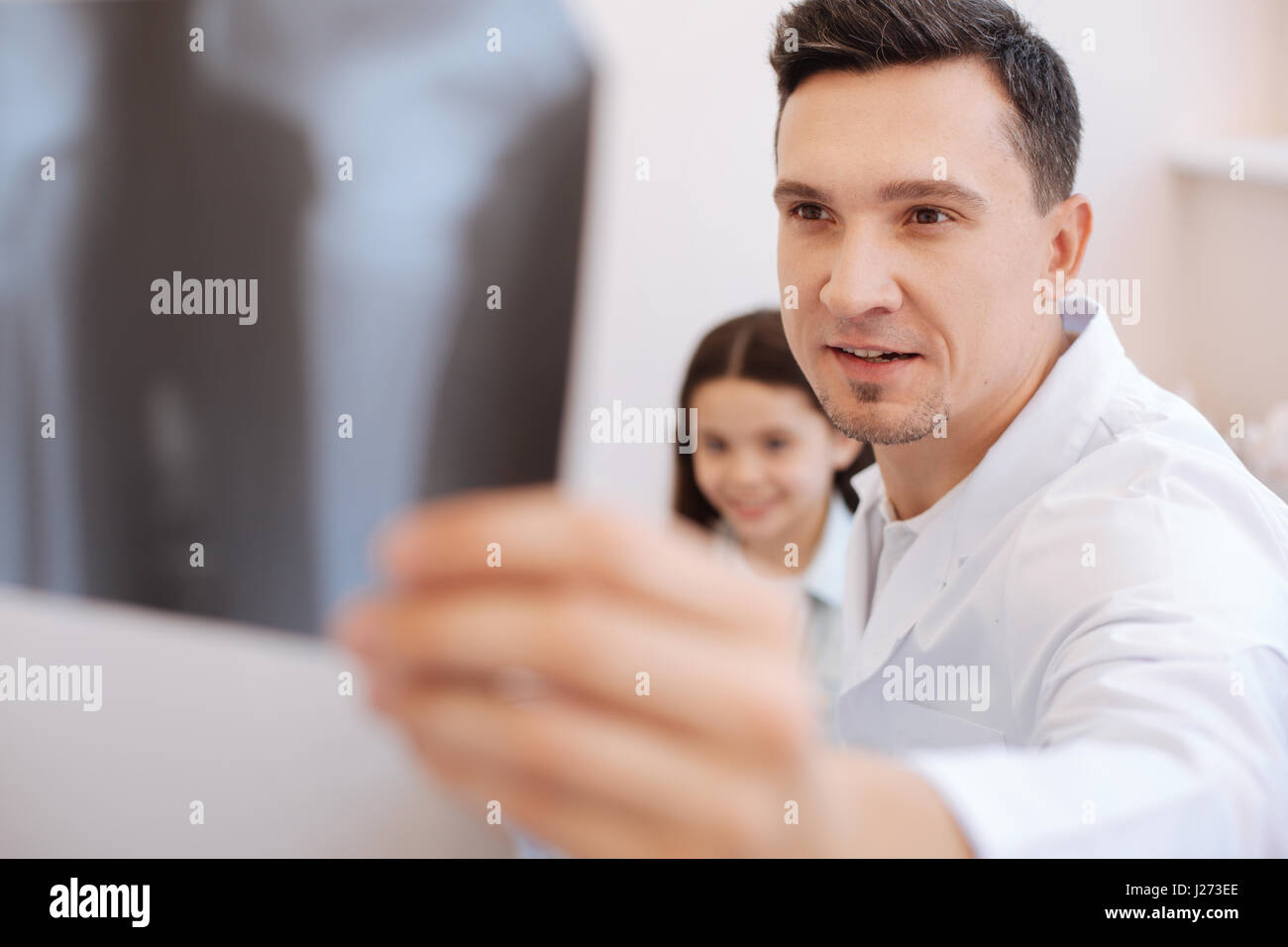 Nice pleasant doctor putting a diagnosis Stock Photo - Alamy