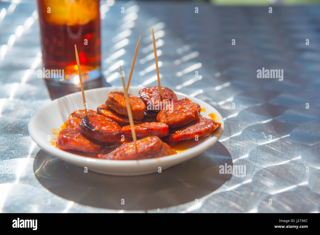 Fried chorizo as tapa in a terrace. Spain Stock Photo - Alamy