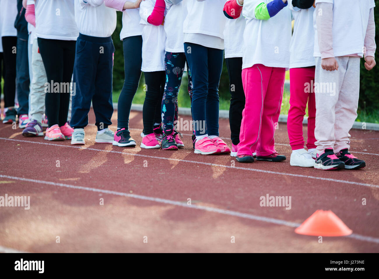 Children in ready position to run on track, closeup Stock Photo - Alamy