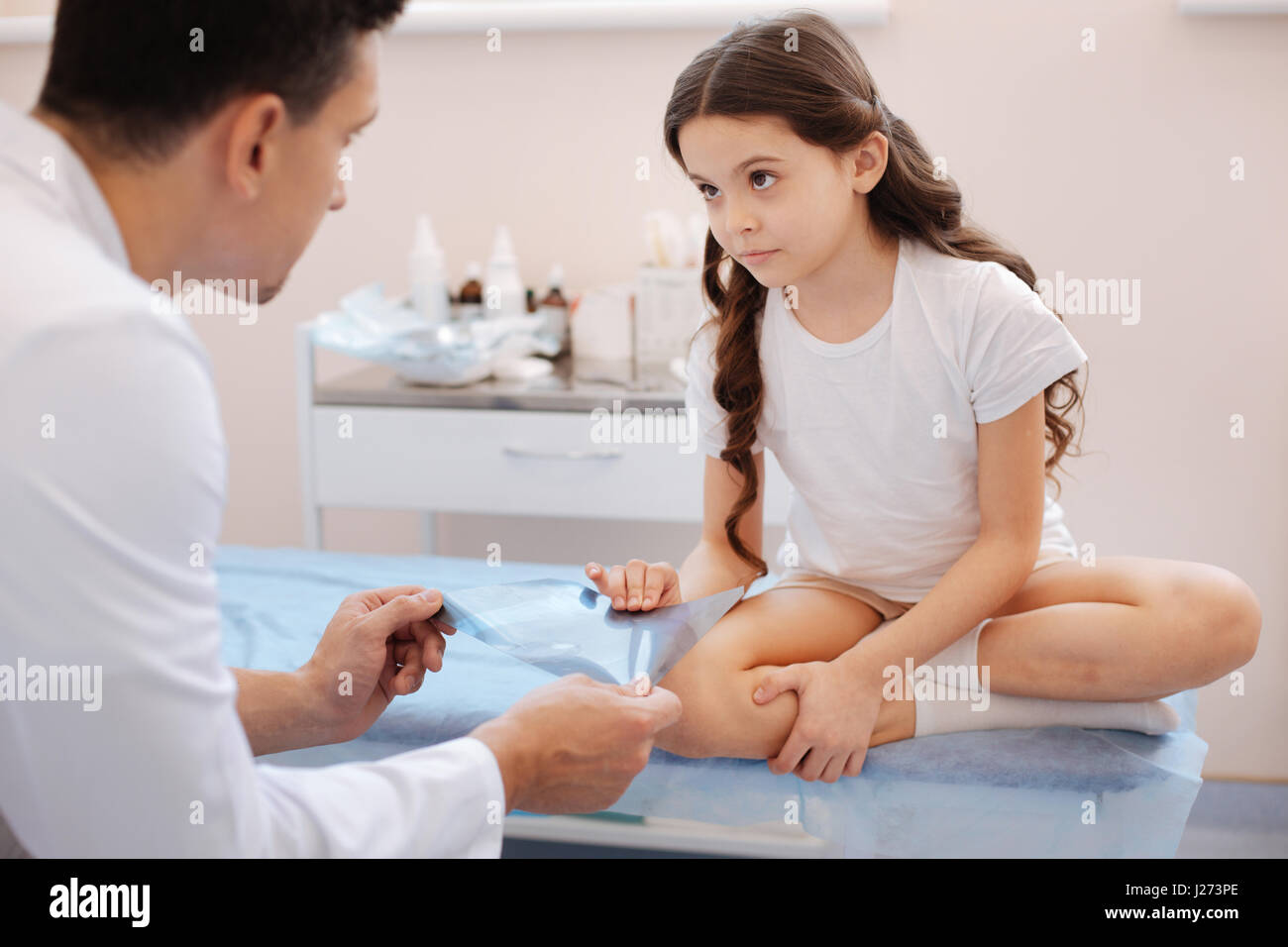 Pretty curious girl taking an X ray image Stock Photo - Alamy
