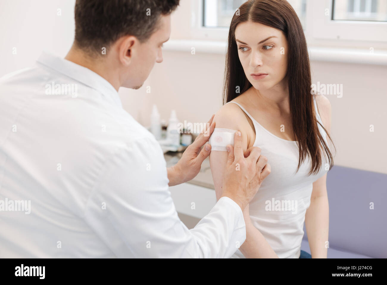 Sad unhappy woman receiving medical help Stock Photo - Alamy