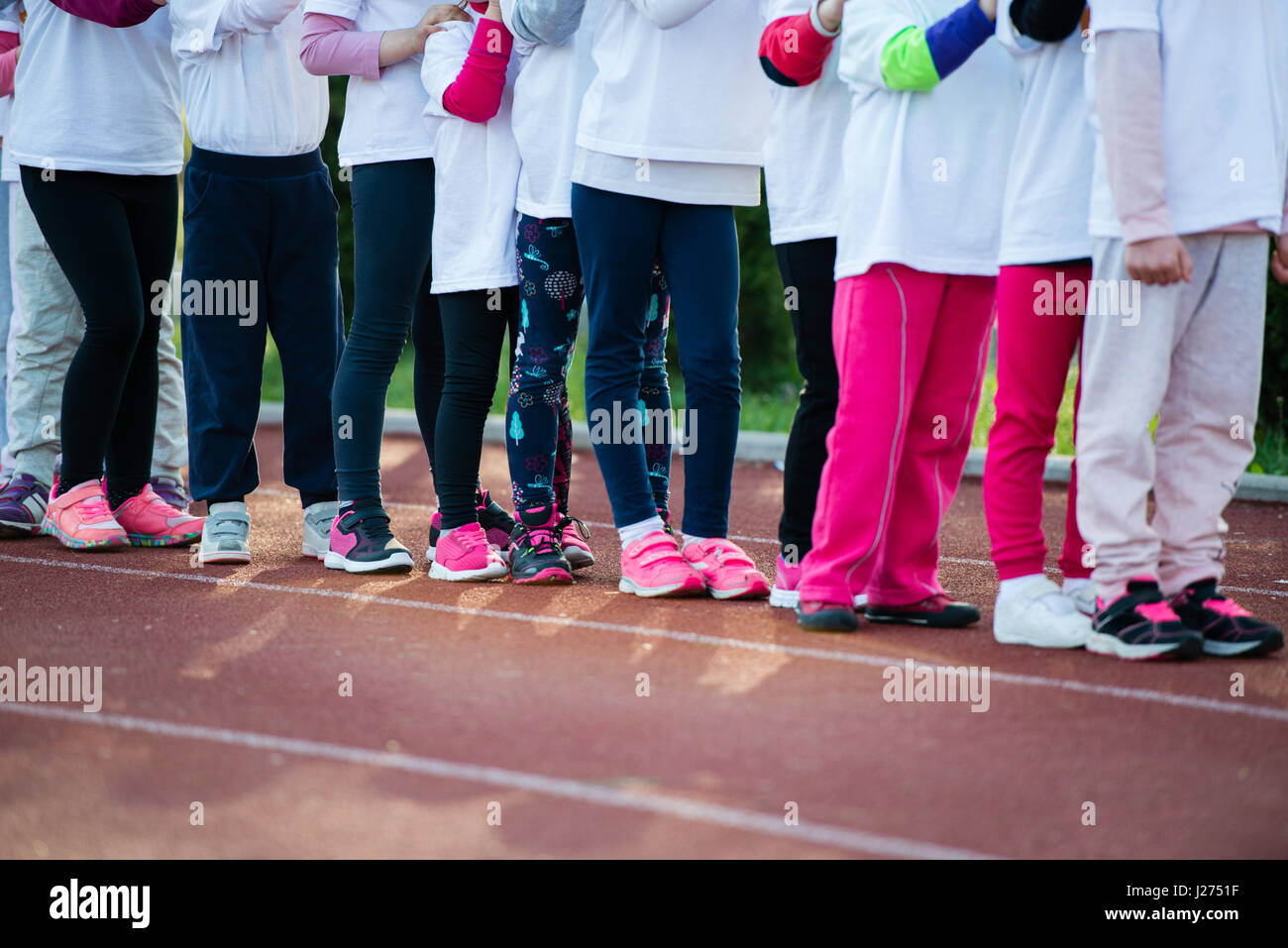 Children in ready position to run on track, closeup Stock Photo - Alamy