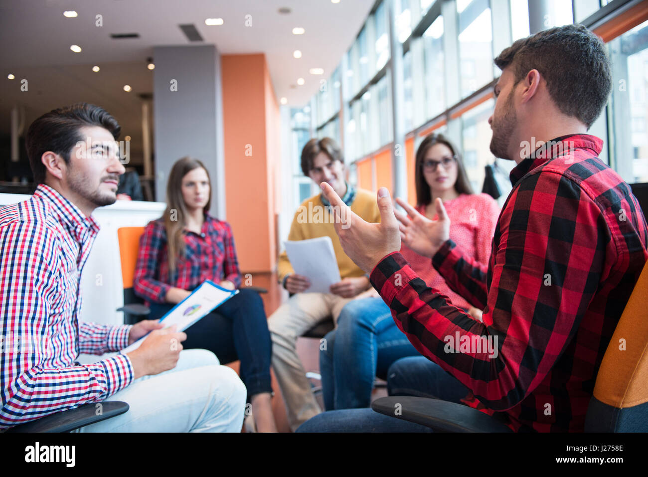 Shot of a group of young business professionals having a meeting Stock ...