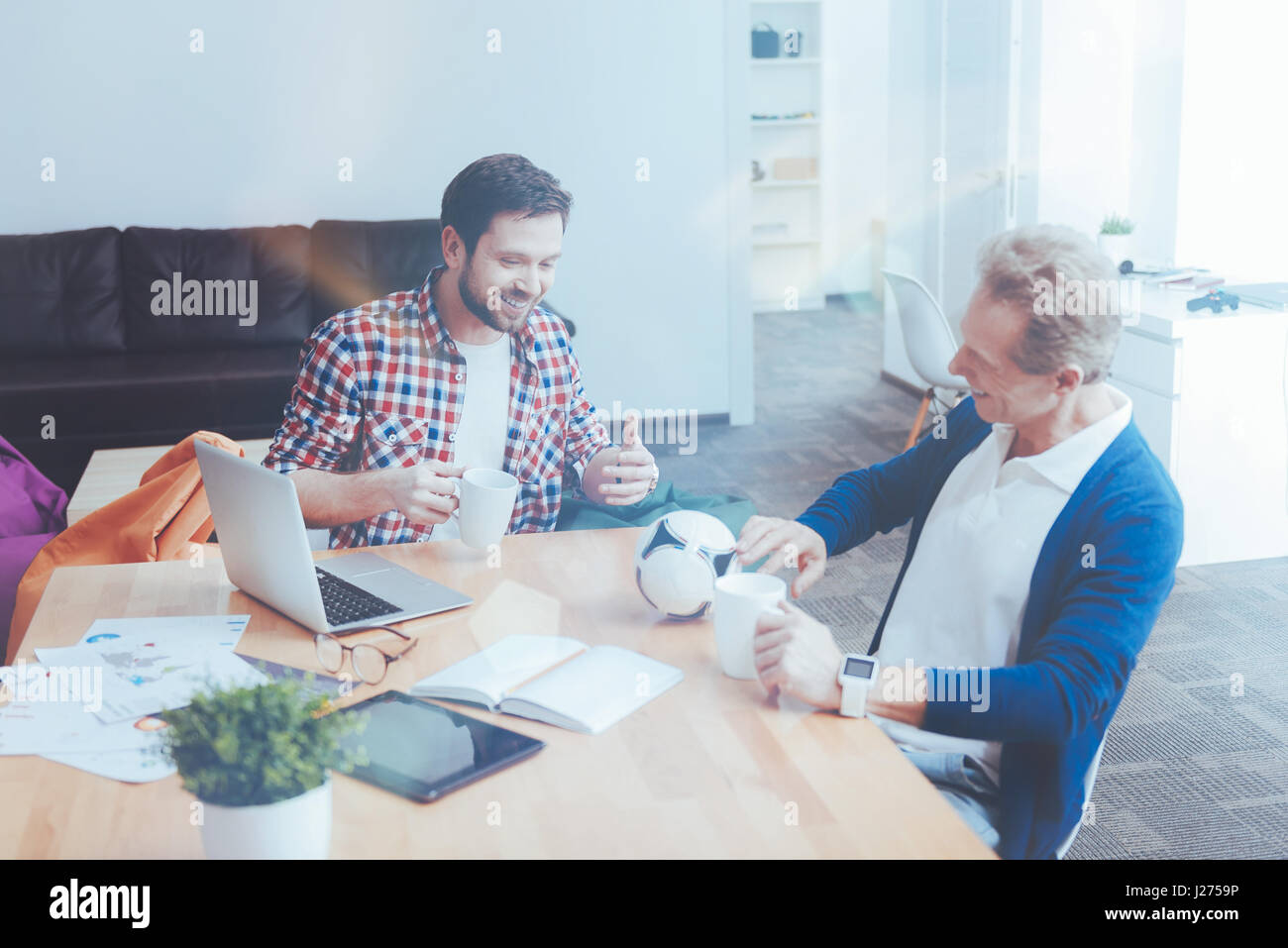 Positive colleagues resting in the office Stock Photo - Alamy