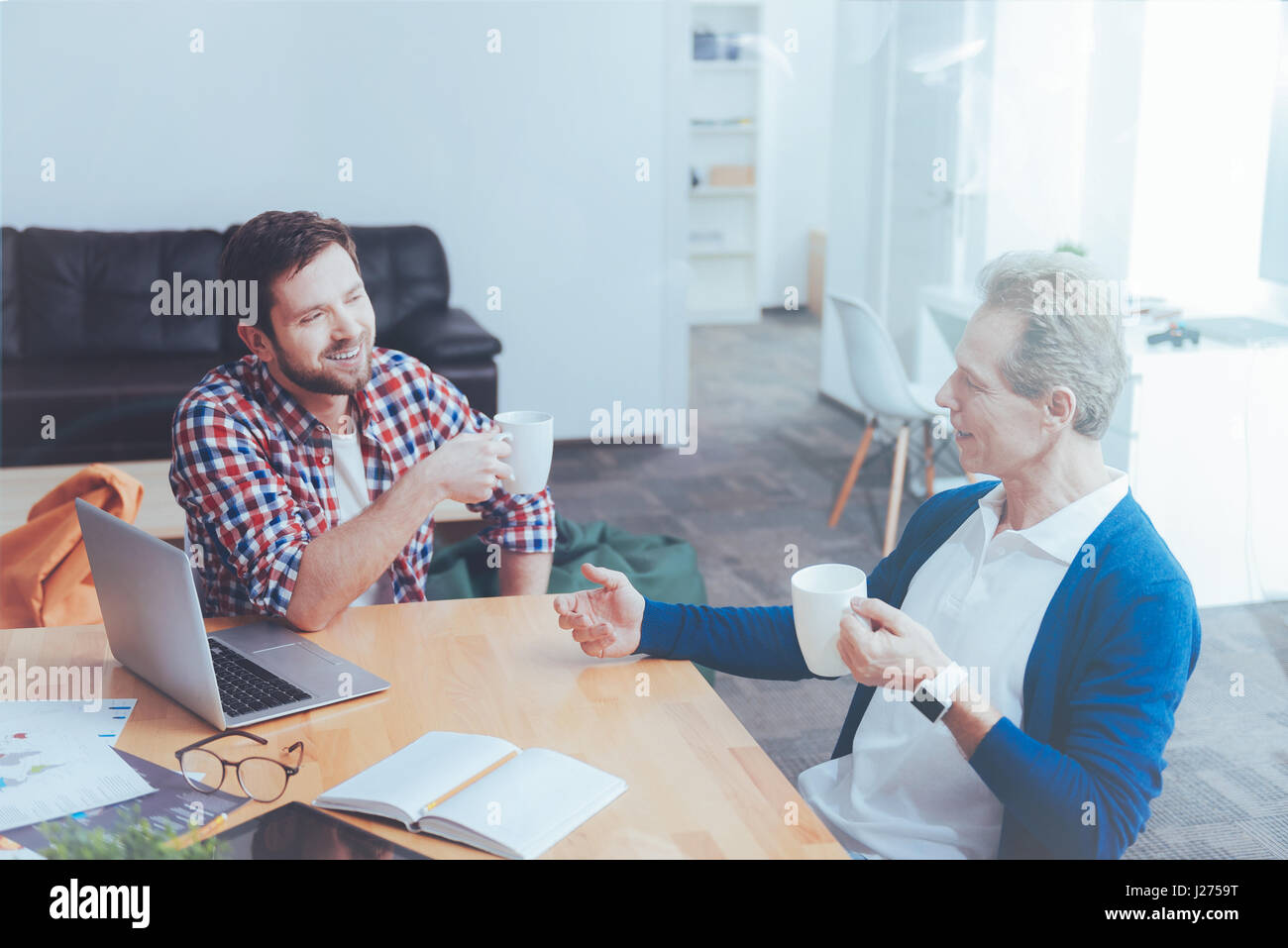 Happy work team during break time in office Stock Photo - Alamy