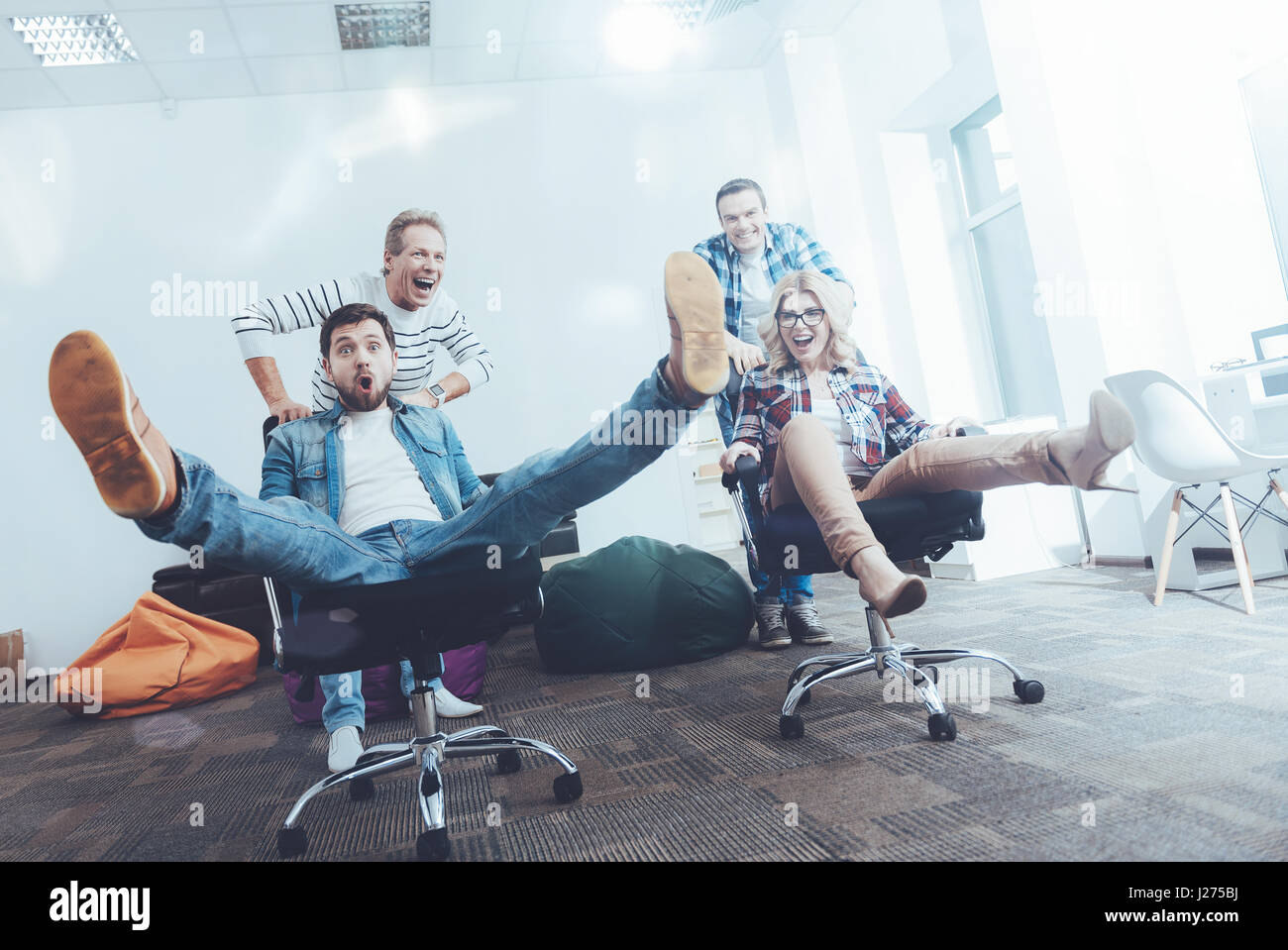 Low angle of cheerful office workers having fun Stock Photo - Alamy