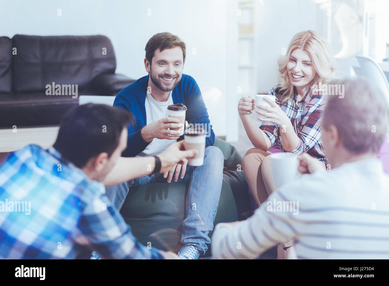 Positive friends resting together Stock Photo - Alamy