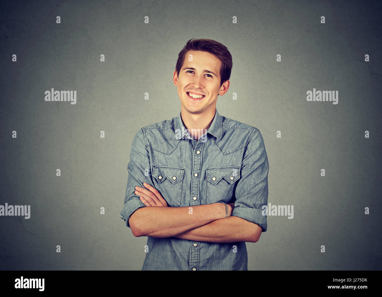 Smiling modern man, creative professional isolated on gray wall ...