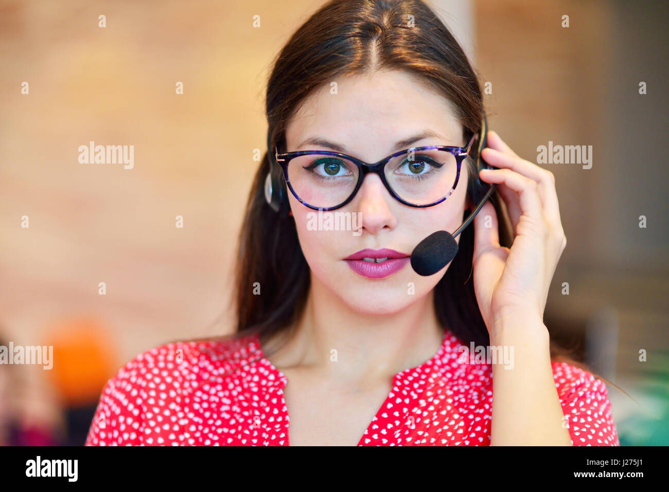 Female customer support operator with headset and smiling Stock Photo - Alamy