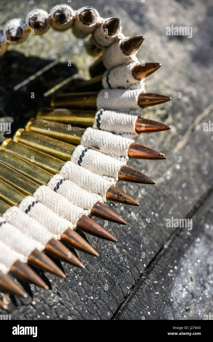 Bullets in ammunition belts outdoor for machine gun Stock Photo - Alamy
