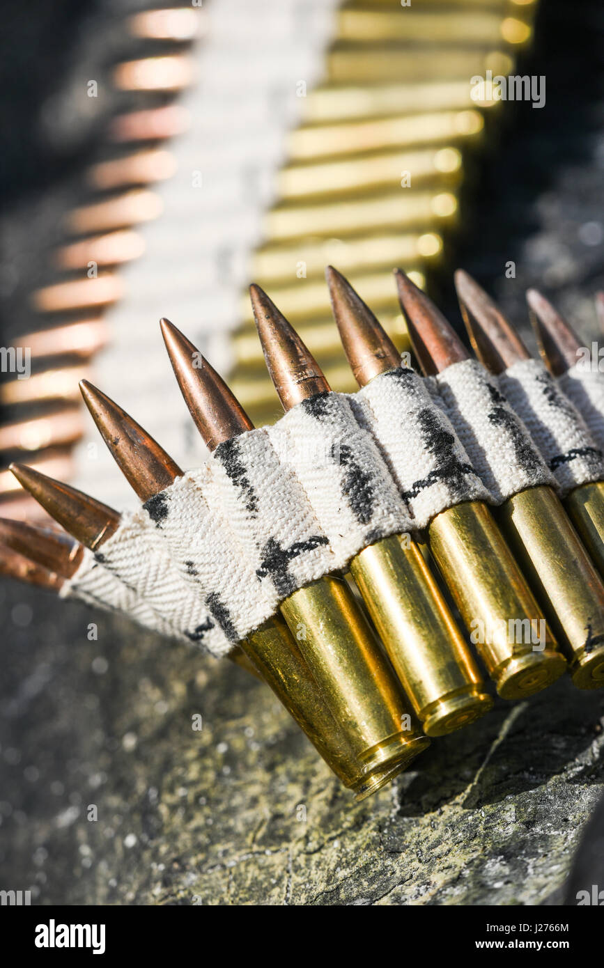 Bullets in ammunition belts outdoor for machine gun Stock Photo - Alamy