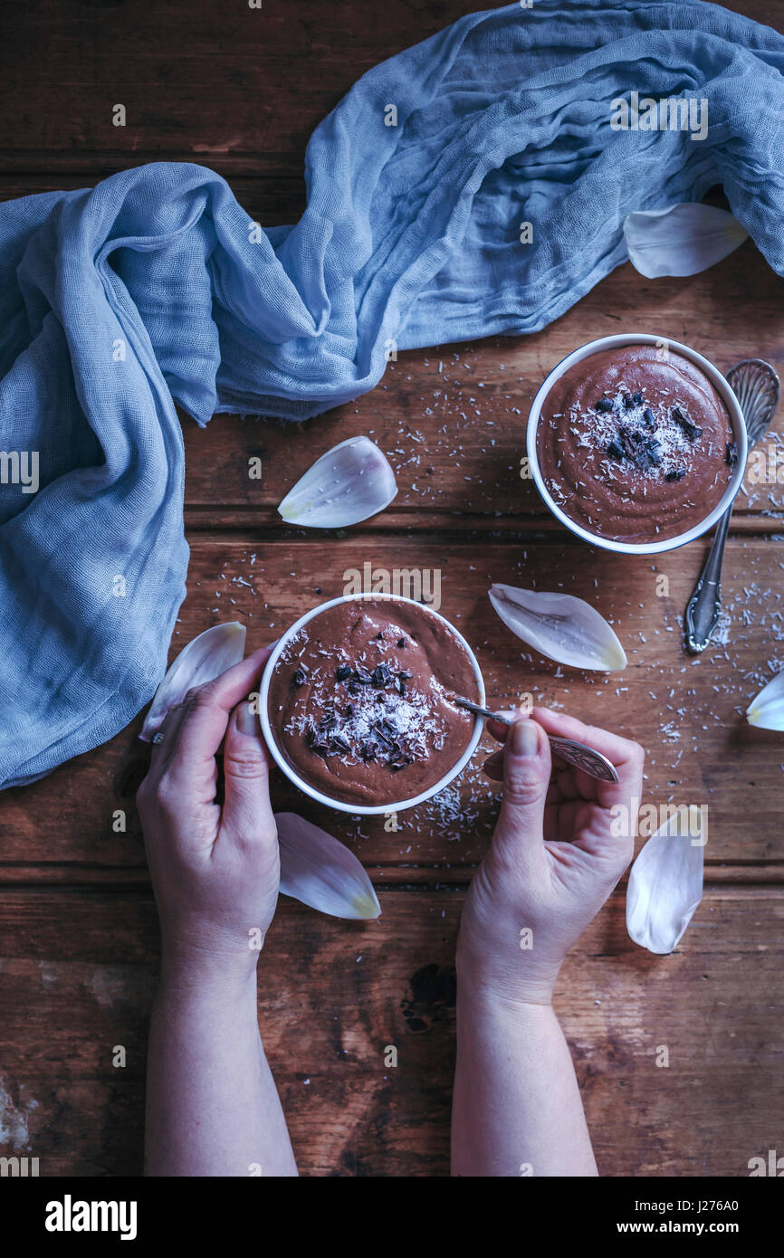 Woman eating chocolate pudding hi-res stock photography and images - Alamy