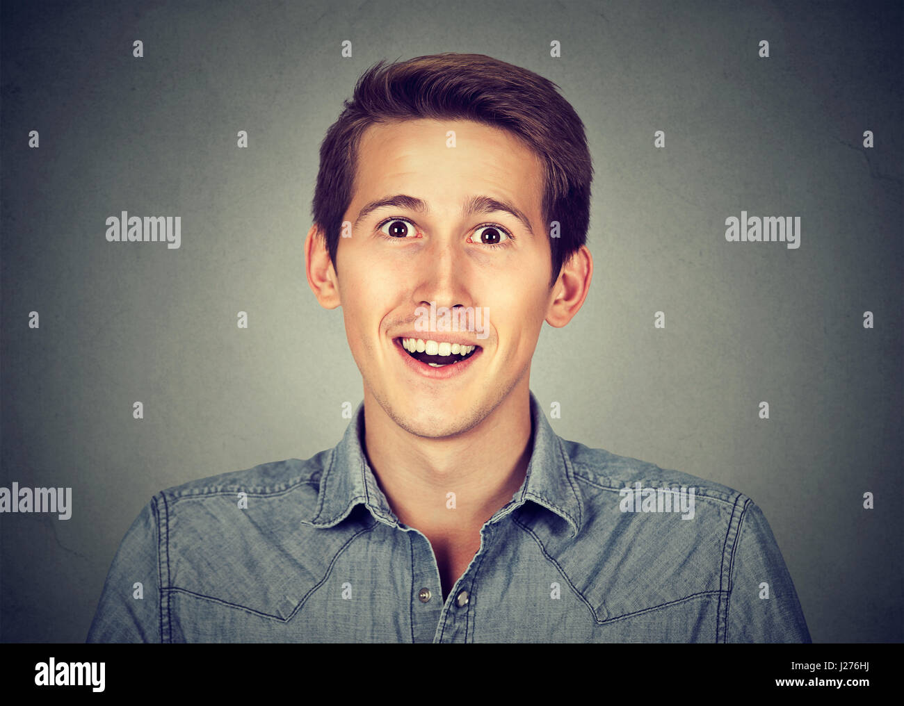 Laughing young man Stock Photo - Alamy