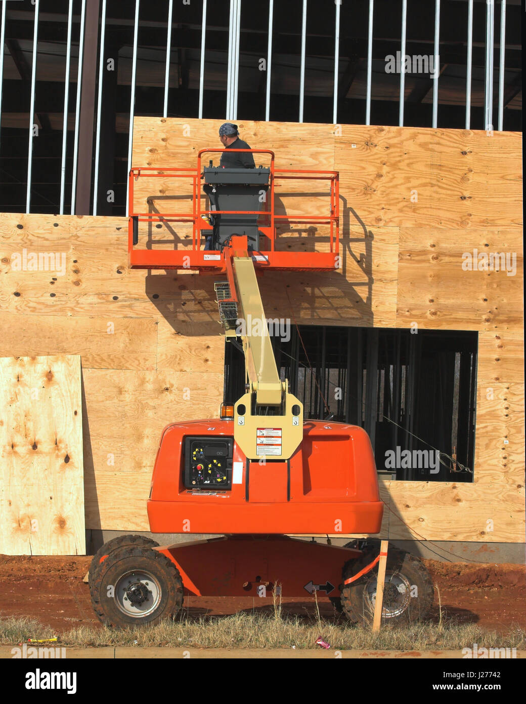 Steel worker bolting together steel beams for new building Stock Photo ...