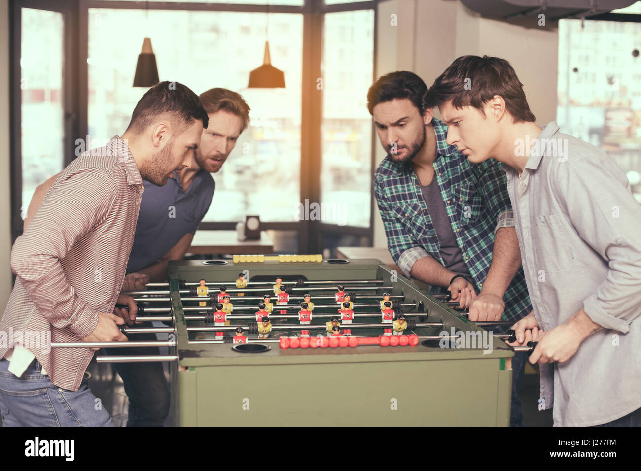 Friends having fun in pub Stock Photo - Alamy