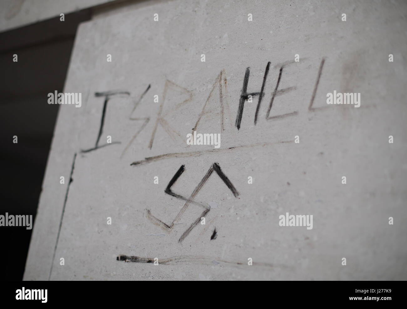 Graffiti saying israhell next to swastika on wall in victoria hi-res ...