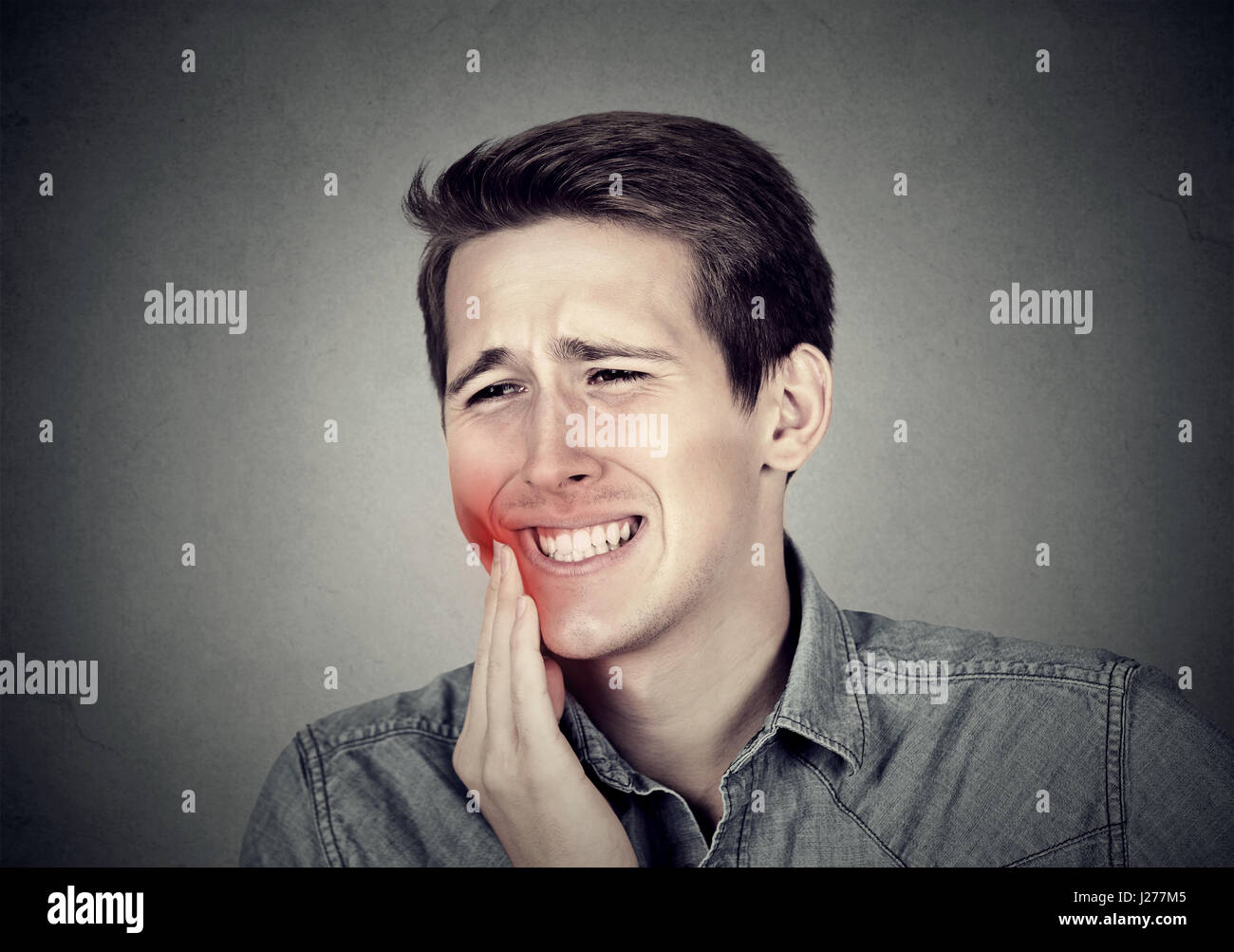 Closeup portrait young man with sensitive toothache crown problem about ...