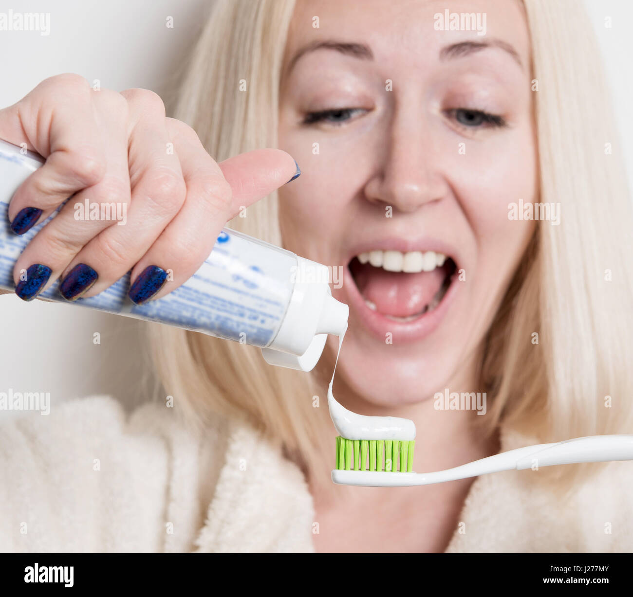 Squeezing toothpaste hi-res stock photography and images - Alamy
