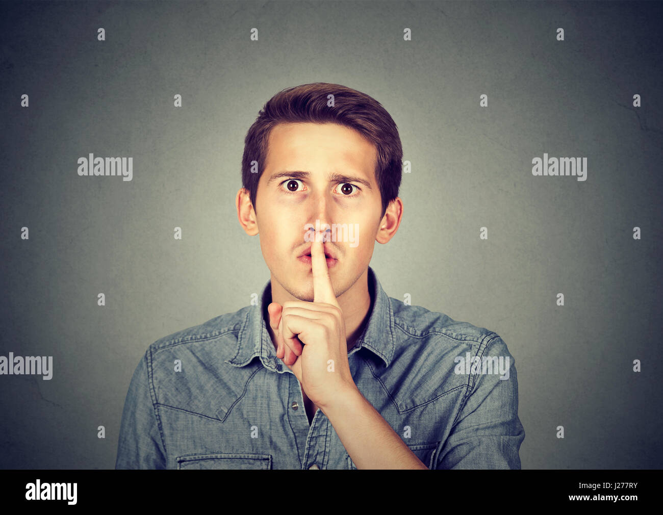 Man giving shhhh quiet hi-res stock photography and images - Alamy