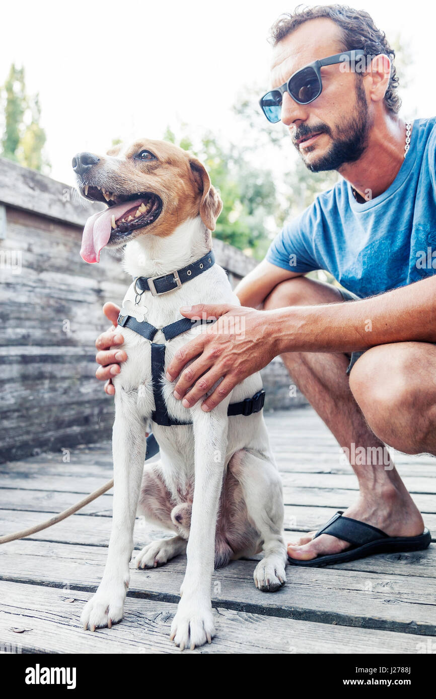 young man with his dog in the park Stock Photo - Alamy