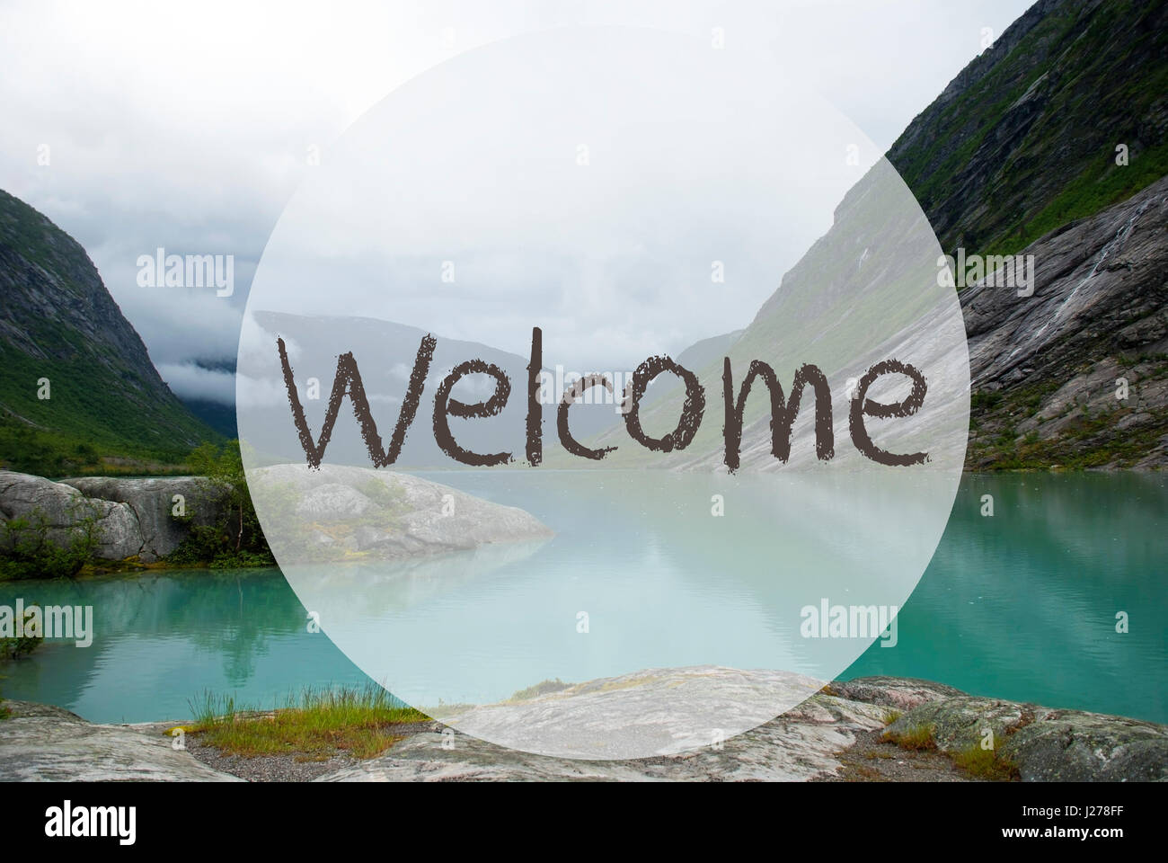 English Text Welcome. Lake With Mountains In Norway. Cloudy Sky ...