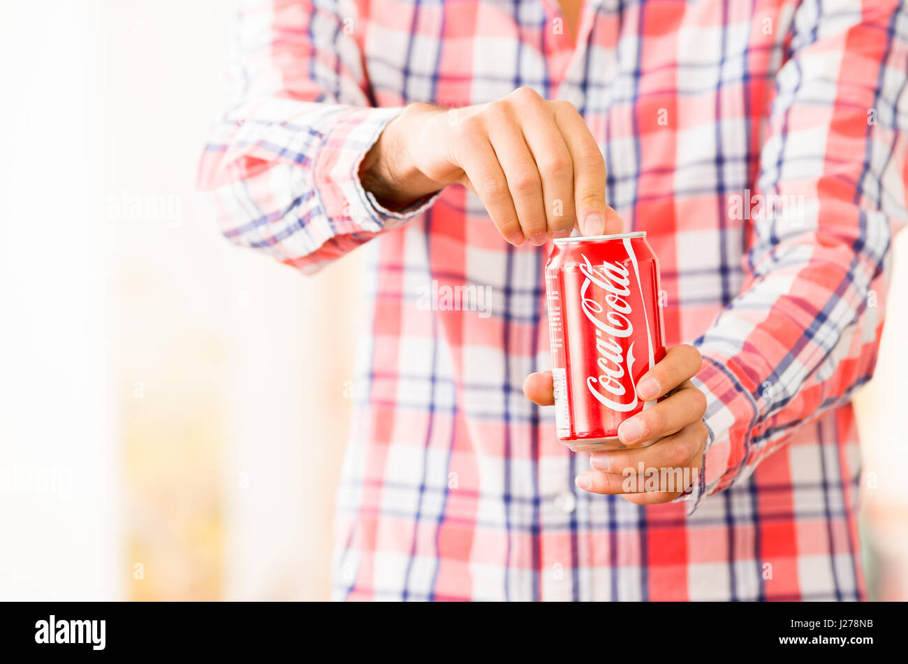 Closeup of young man hands opening a Coca-Cola can Stock Photo - Alamy