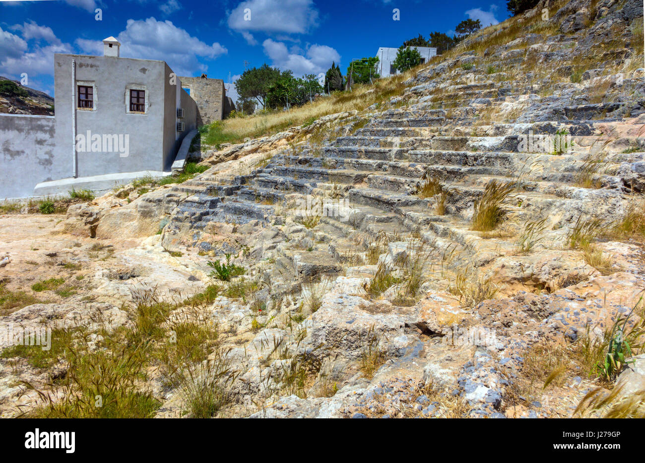 Ancient amphitheatre caved into rock, Lindos, Rhodes, Greece Stock ...