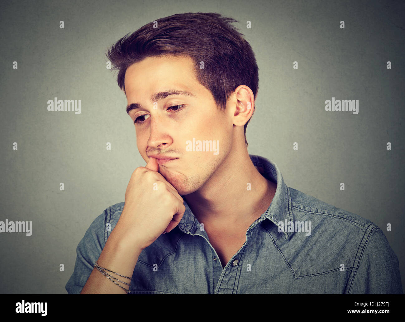 portrait of young bored man Stock Photo - Alamy