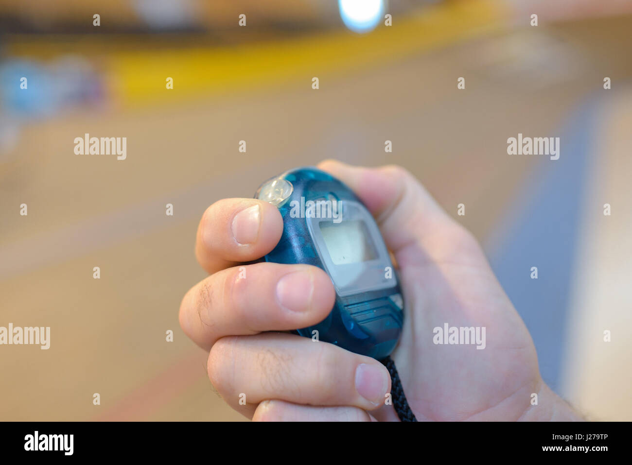 Closeup of hand holding stopwatch Stock Photo - Alamy