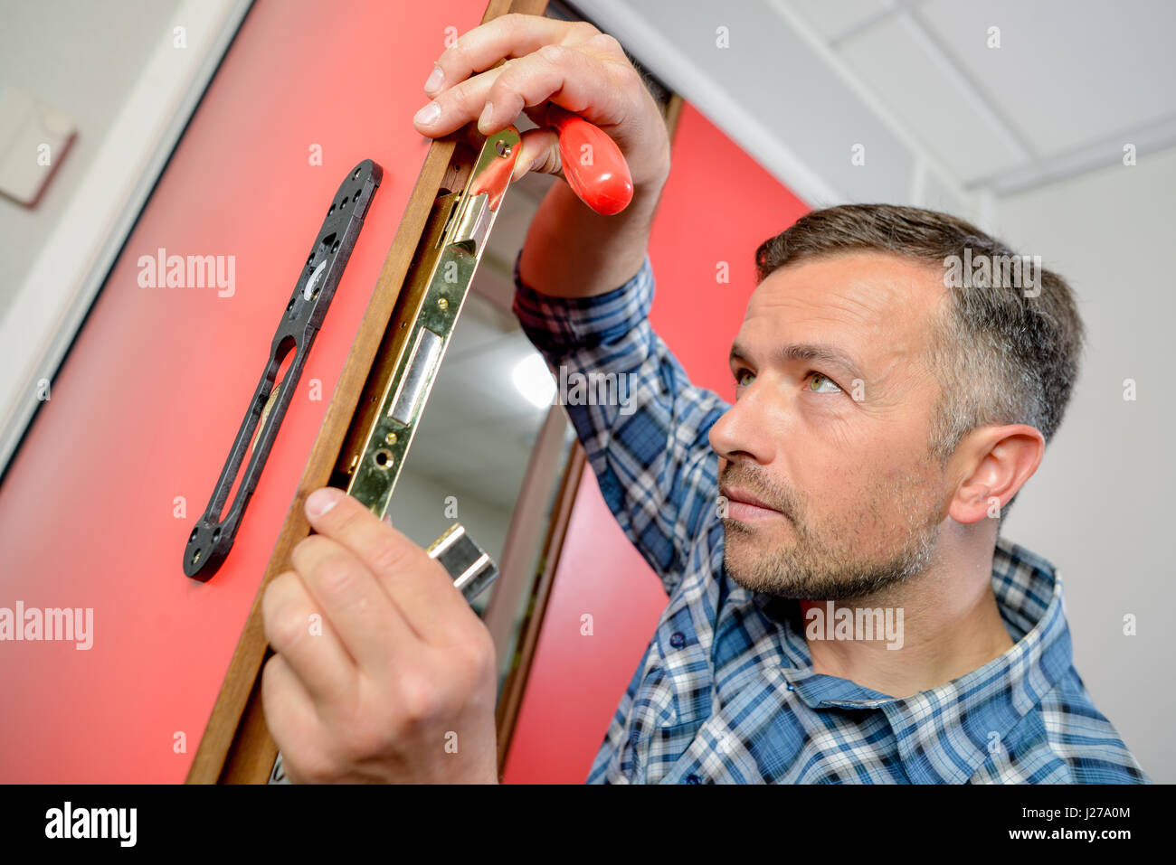 Fitting a new lock Stock Photo - Alamy