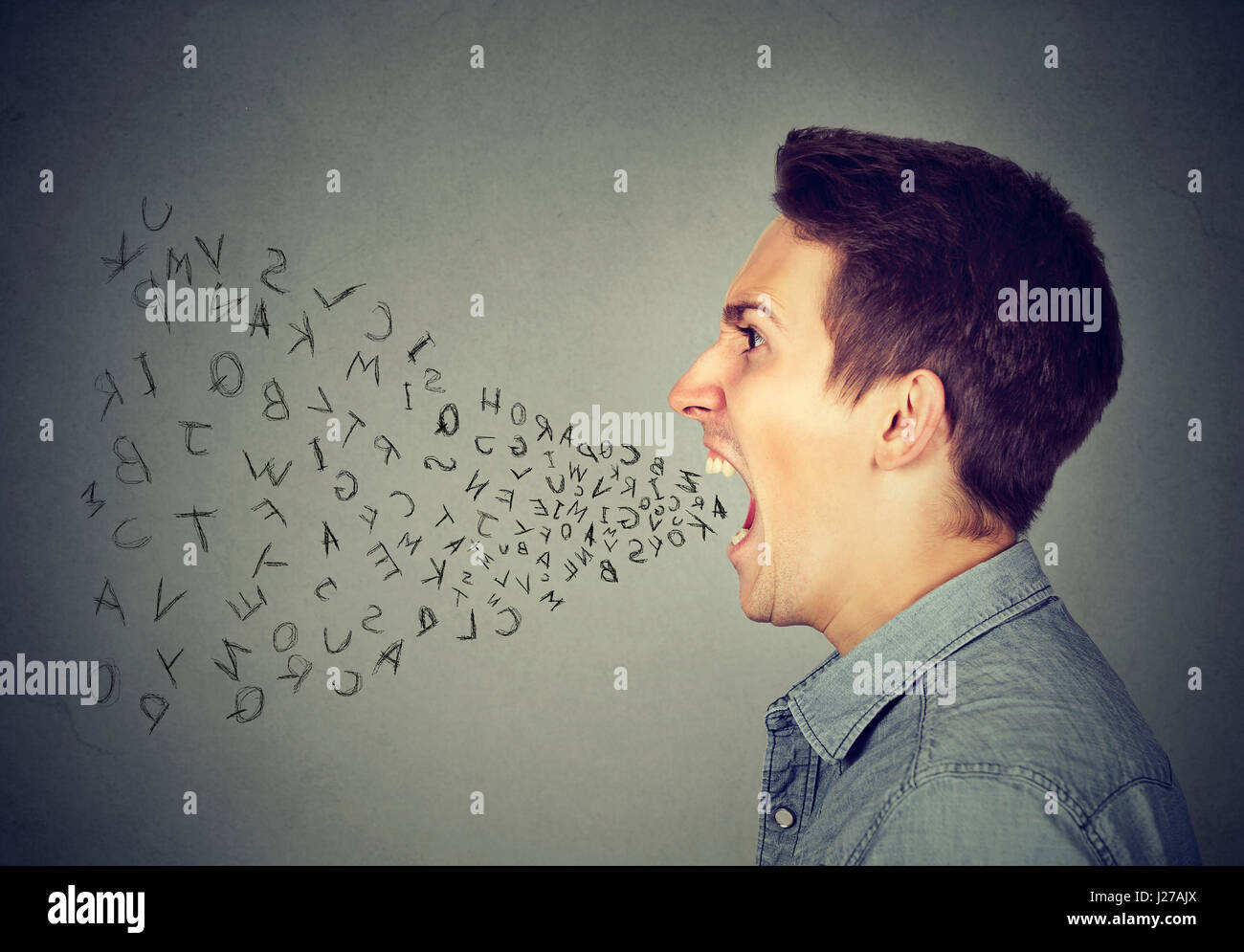 Side profile portrait of young angry man screaming with alphabet ...