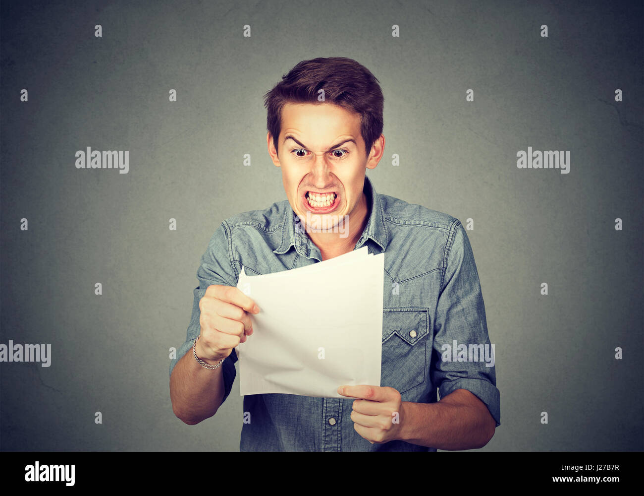 Angry stressed screaming business man with documents papers paperwork ...