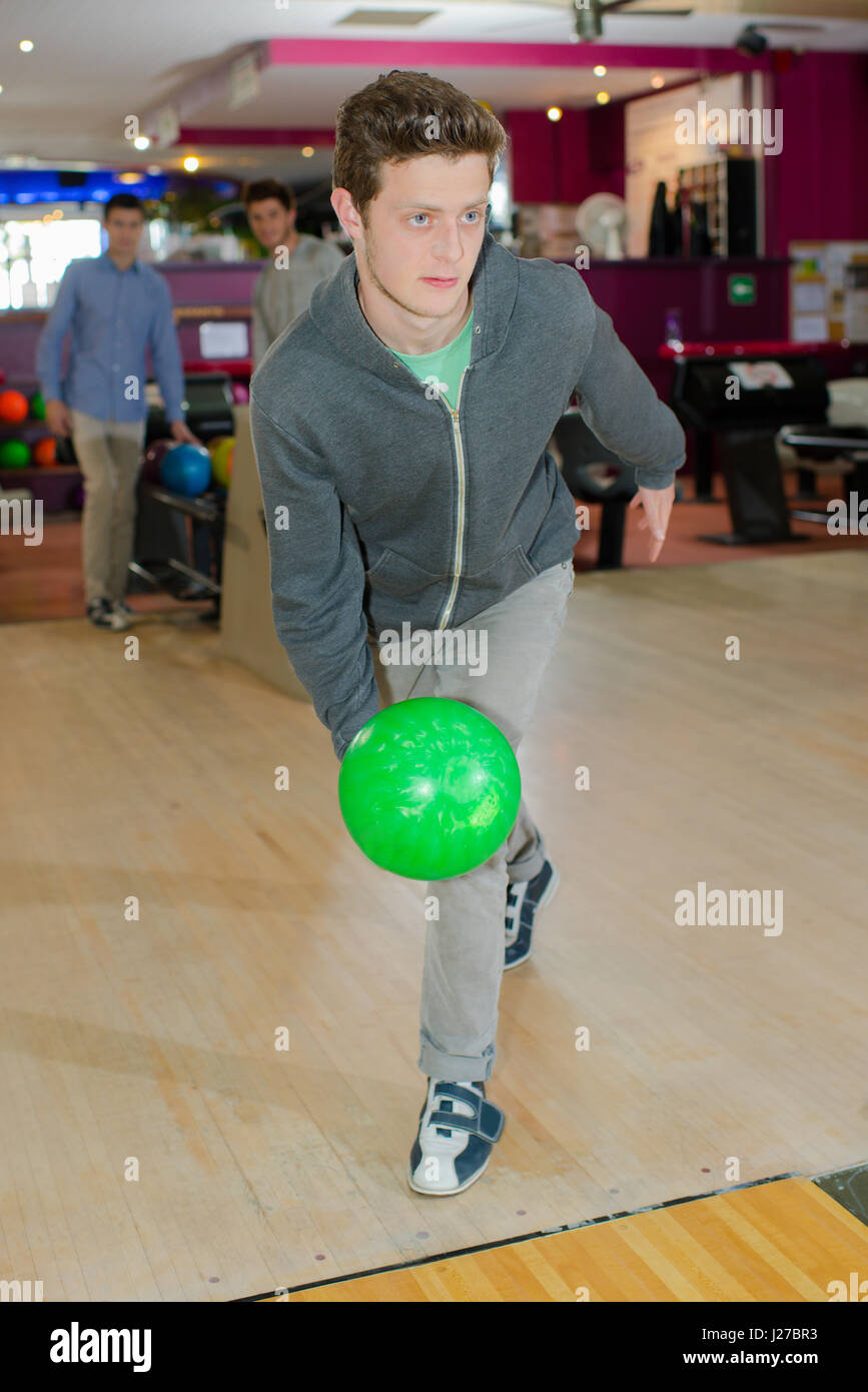 young man playing bowling Stock Photo - Alamy