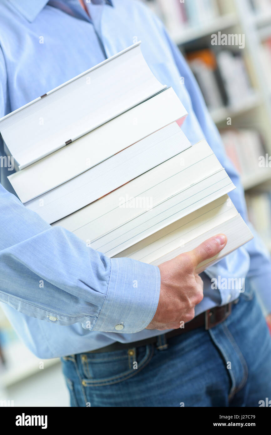 carrying the books Stock Photo - Alamy