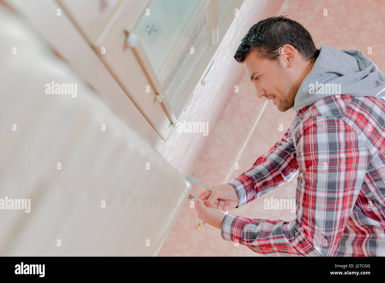 Mason working alone Stock Photo - Alamy