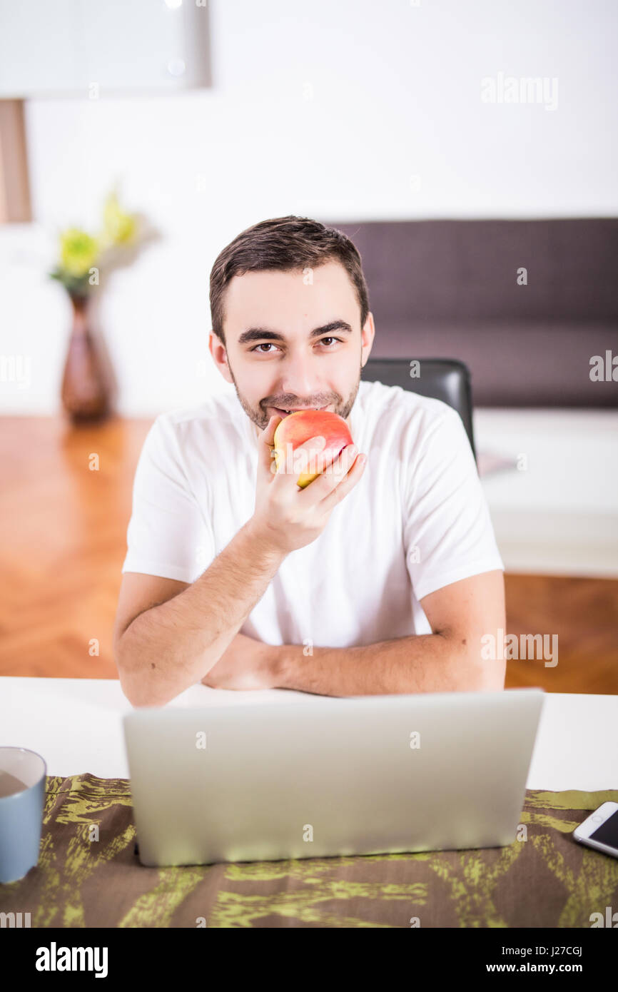 Apple man eating reading hi-res stock photography and images - Alamy