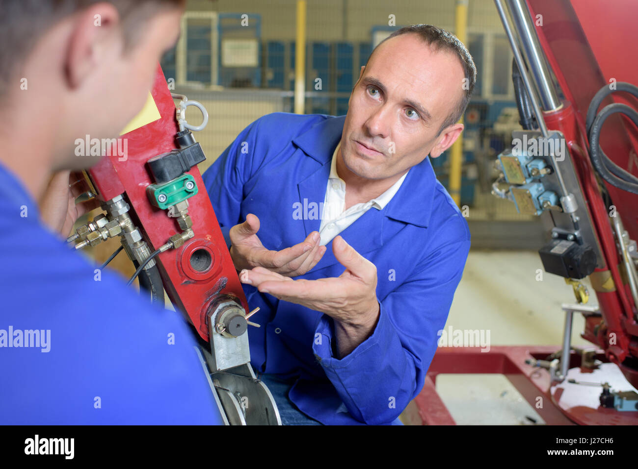 fixing a heavy machinery Stock Photo - Alamy