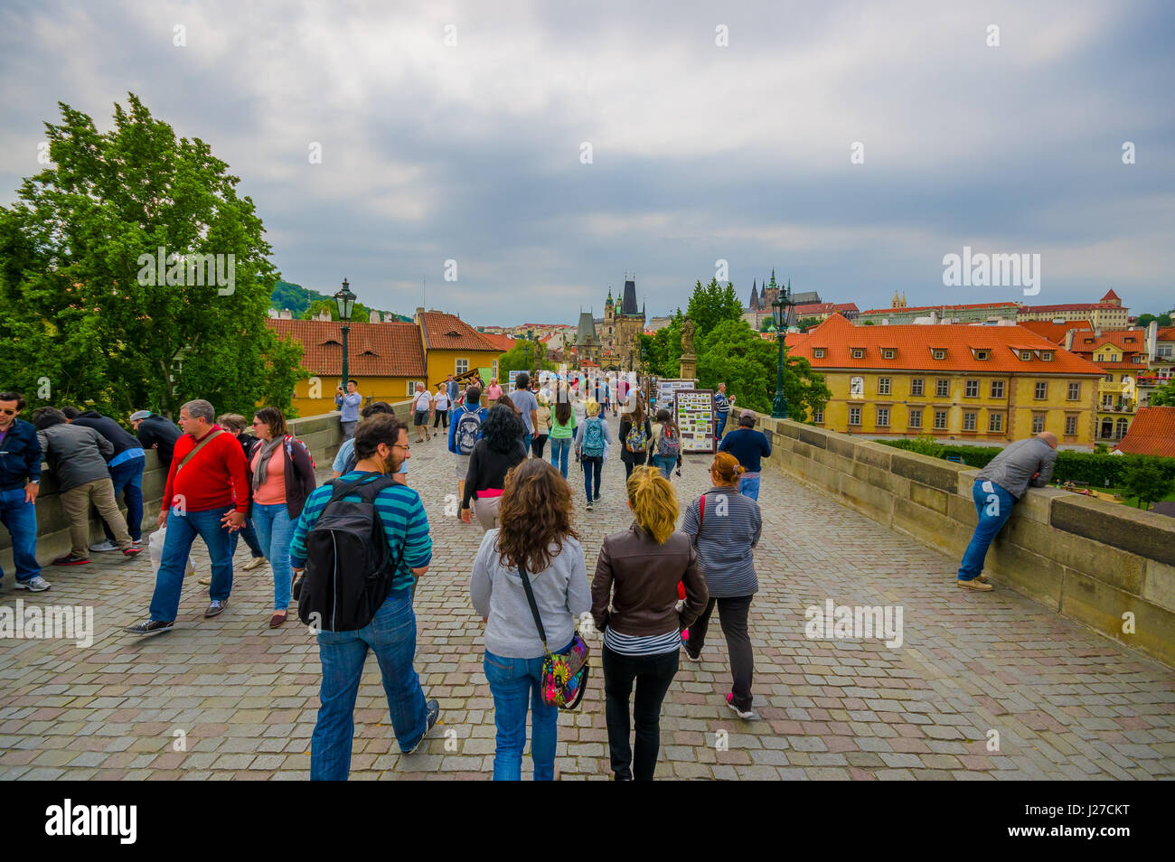 Prague, Czech Republic - 13 August, 2015: People crossing over charming ...