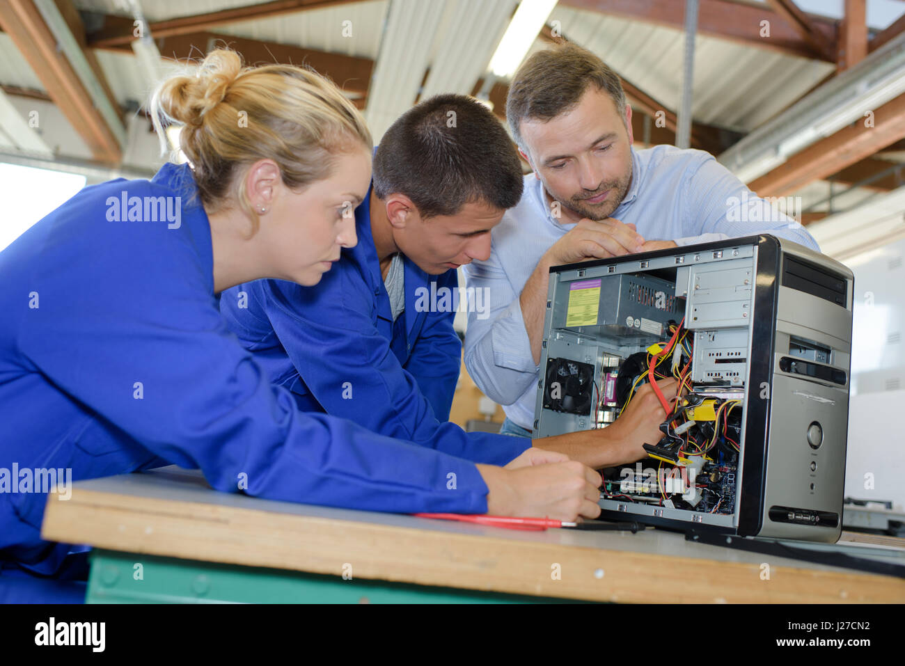 trying to fix a motherboard Stock Photo - Alamy