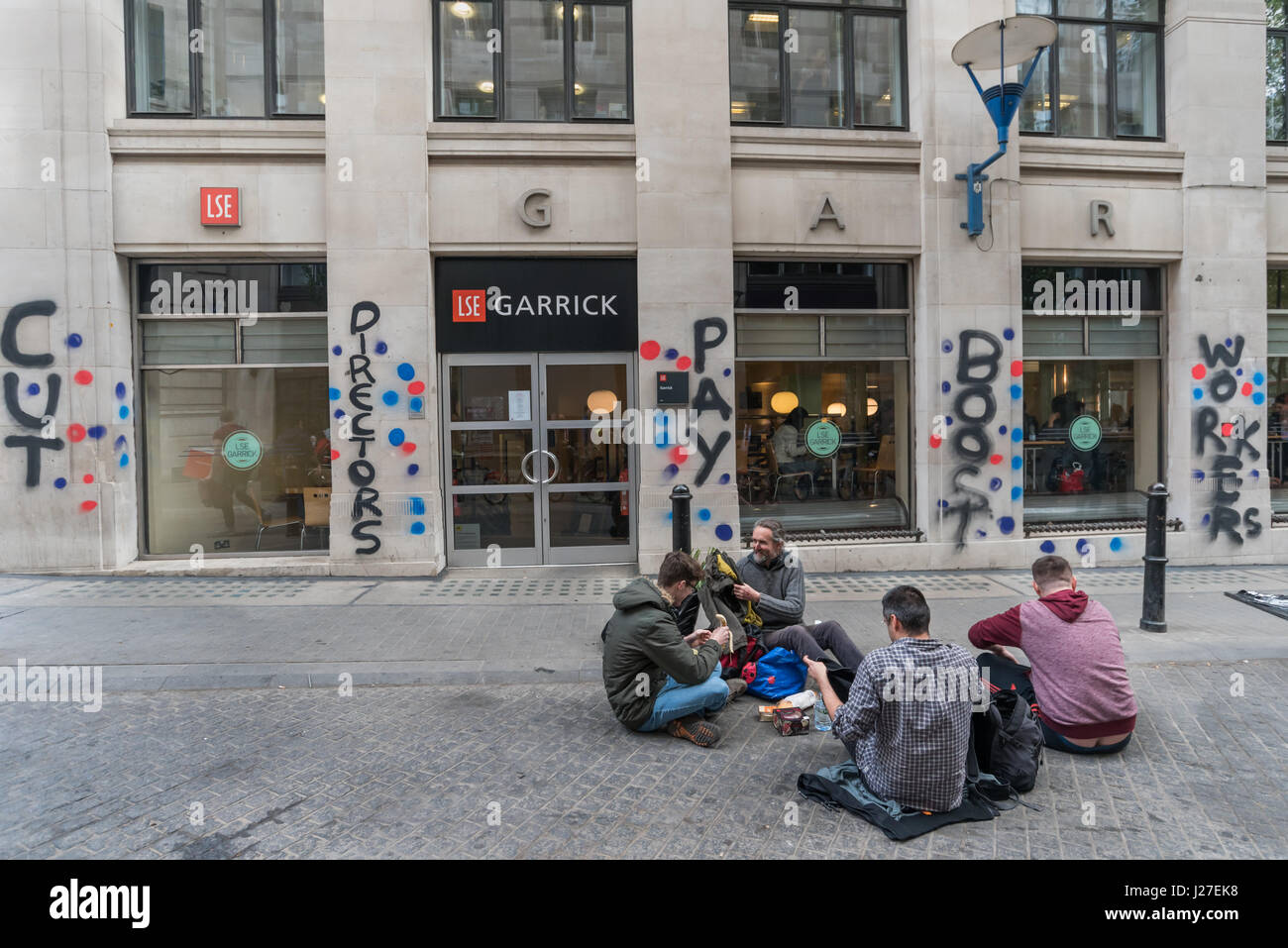 London, UK. 25th April 2017. Four campaigners who painted the slogan ...