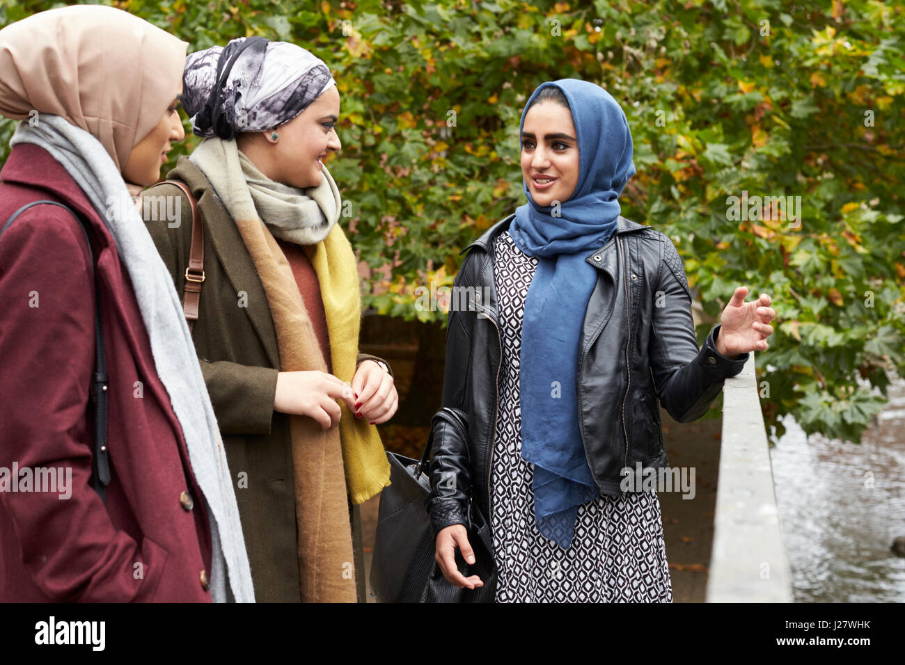 Muslim woman and british woman talking hi-res stock photography and ...