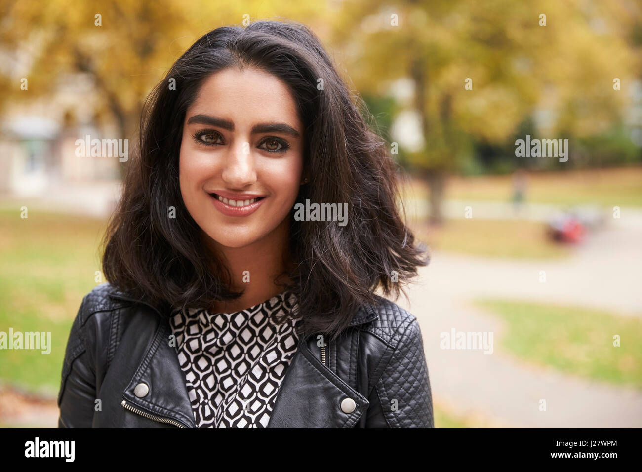 Portrait Of British Muslim Woman In Urban Park Stock Photo - Alamy