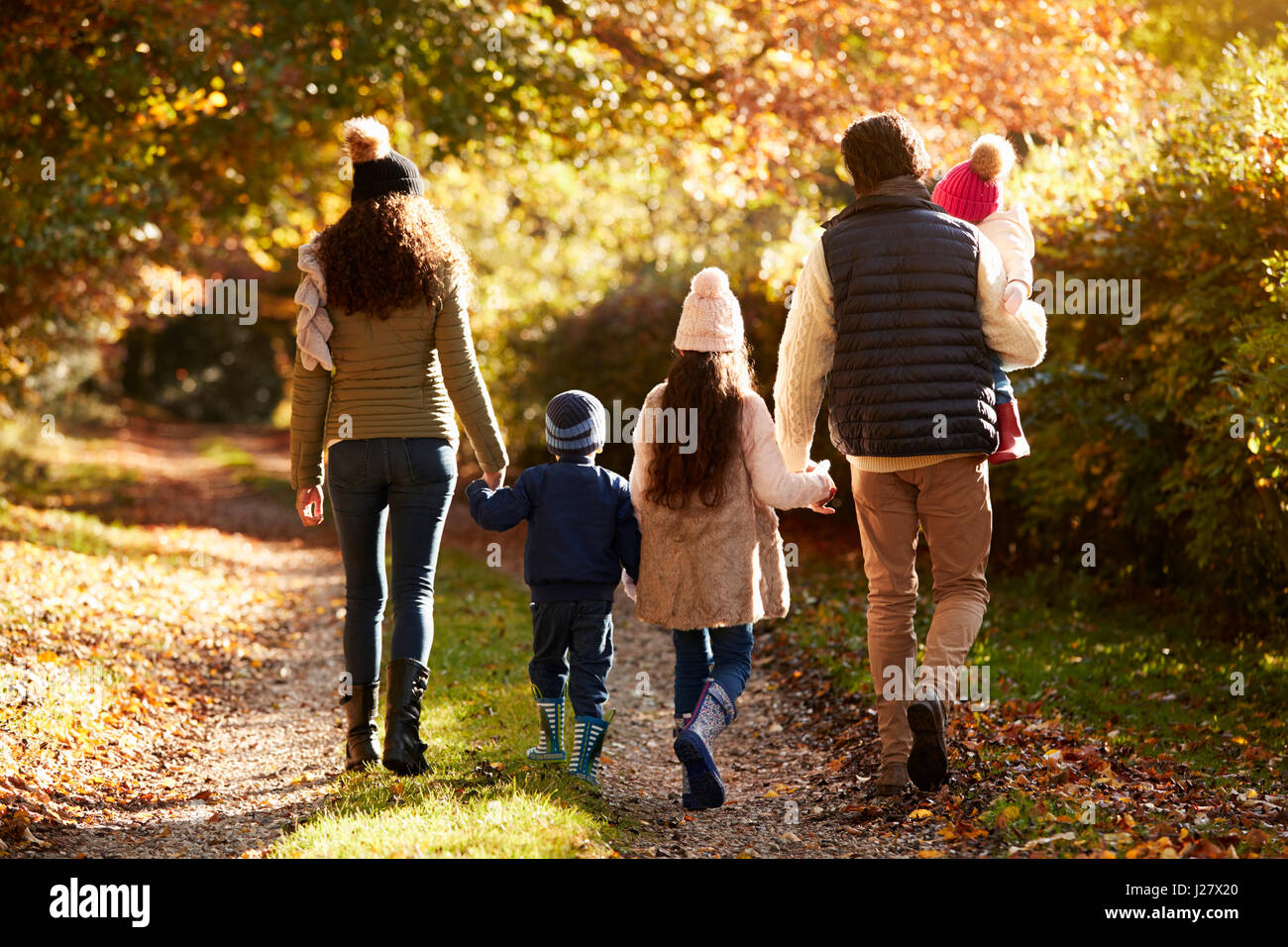 Rear View Of Family Enjoying Autumn Walk In Countryside Stock Photo - Alamy