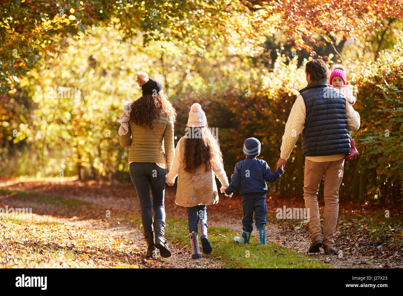 Rear View Of Family Enjoying Autumn Walk In Countryside Stock Photo - Alamy