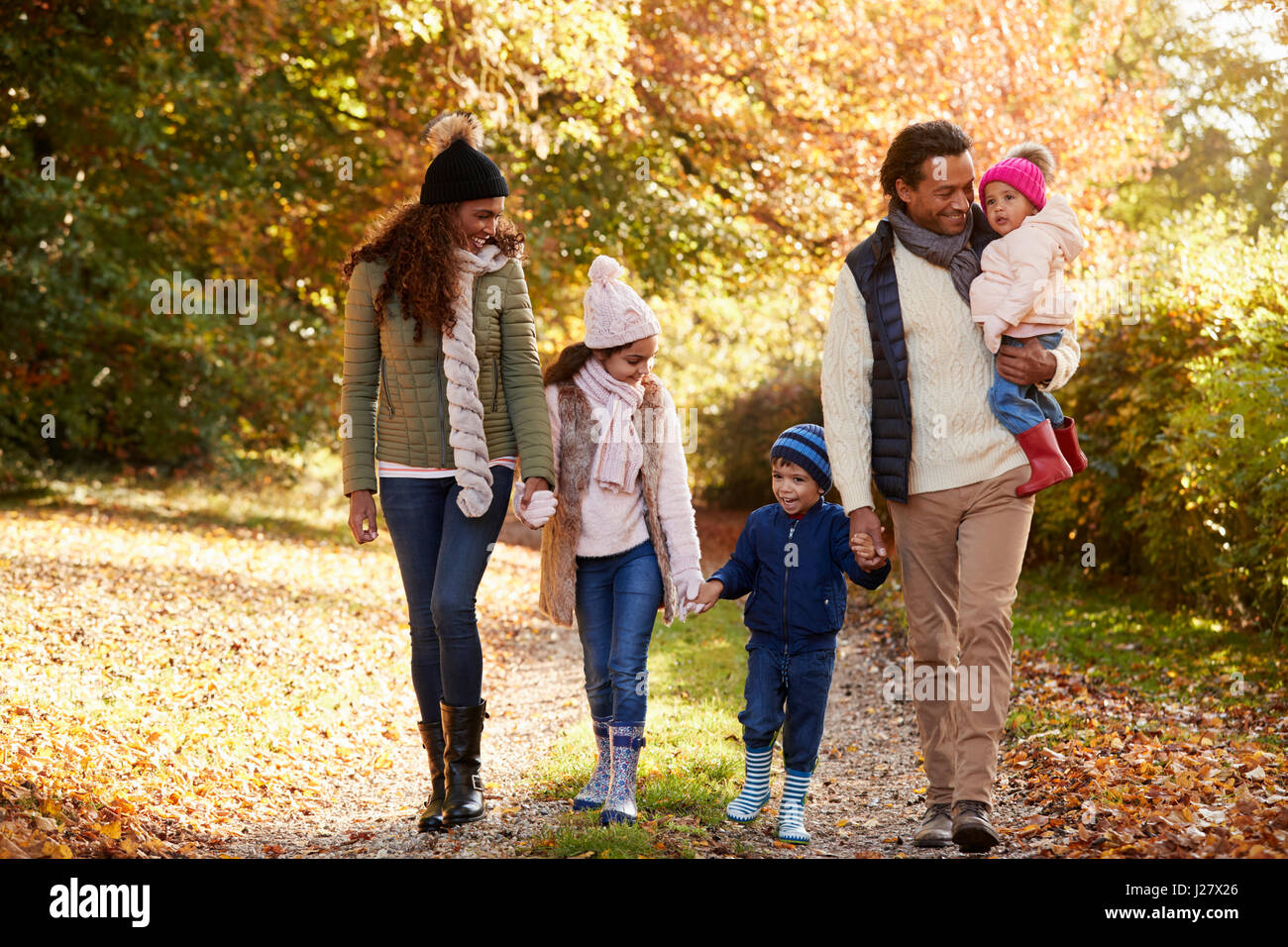 Front View Of Family Enjoying Autumn Walk In Countryside Stock Photo ...